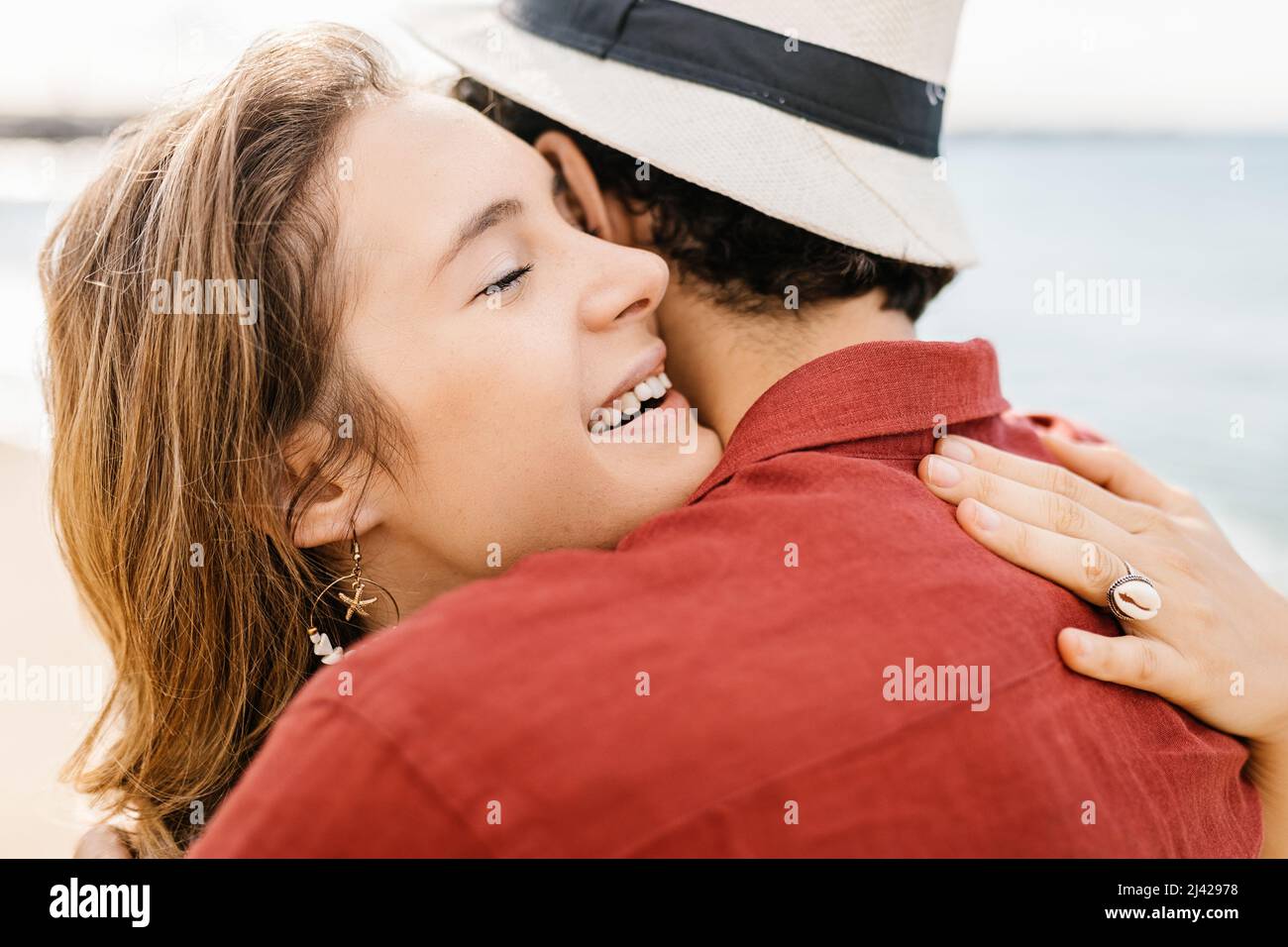 Lovely and happy couple hugging each other outdoors Stock Photo - Alamy