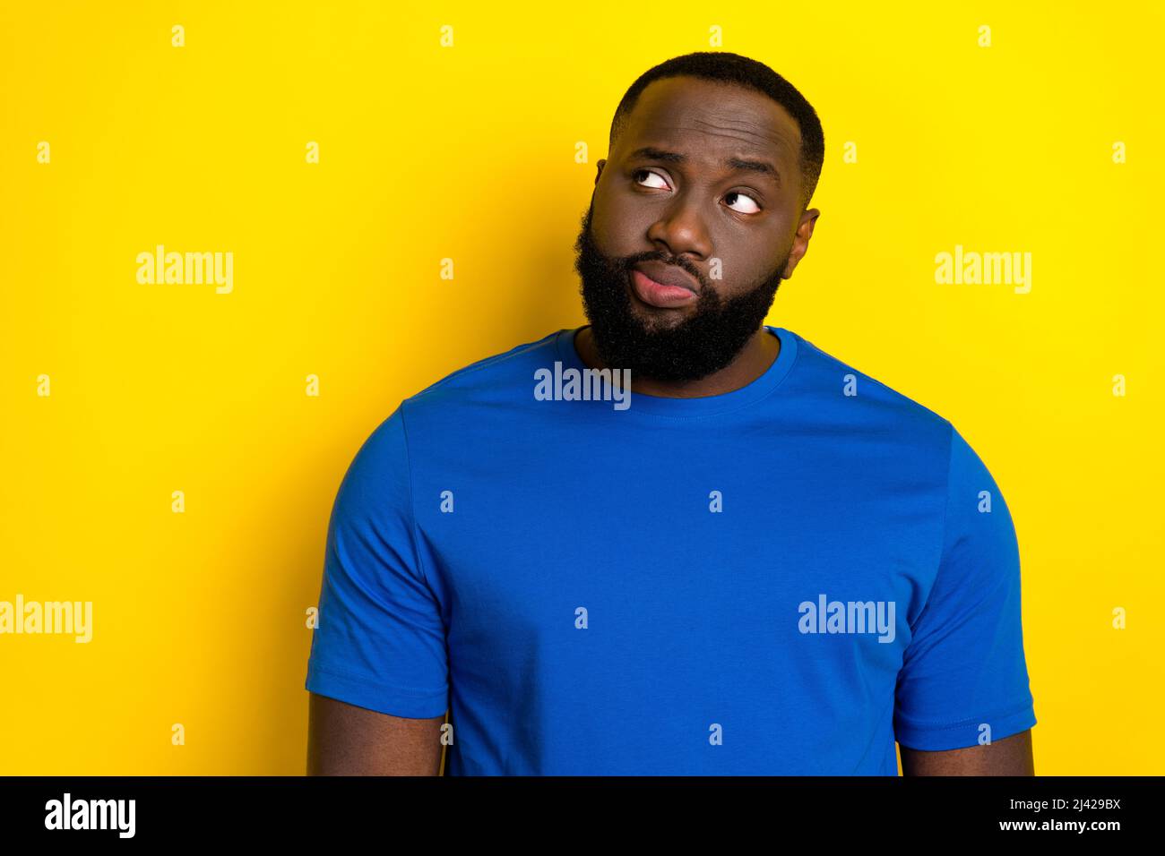 Portrait of attractive suspicious guy making decision copy space ...