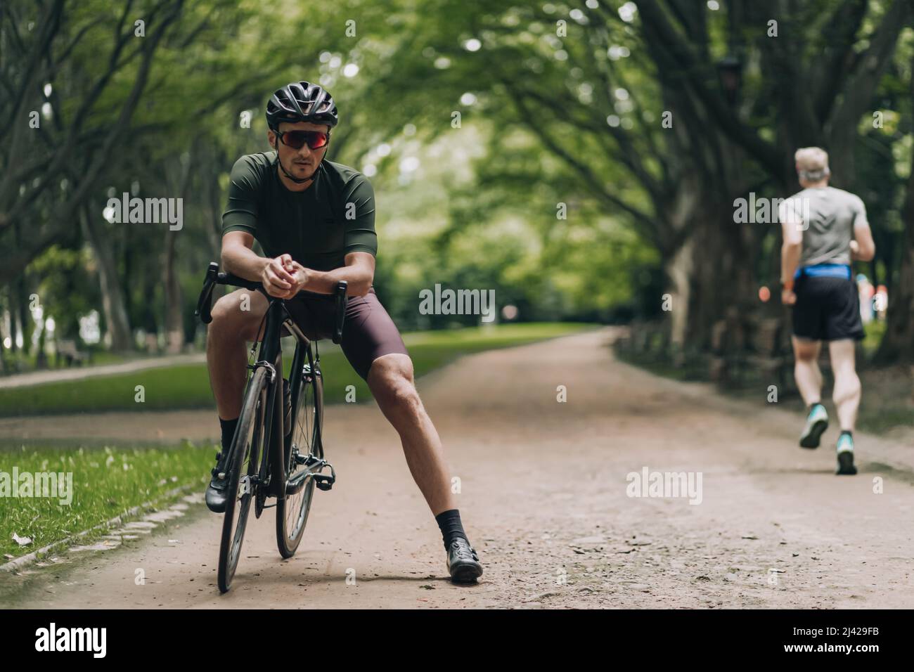 Man on bike taking break hi-res stock photography and images - Alamy