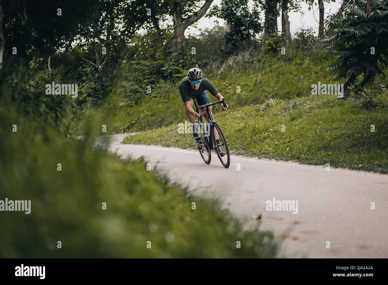Active caucasian man in sportswear, helmet and glasses having active ...