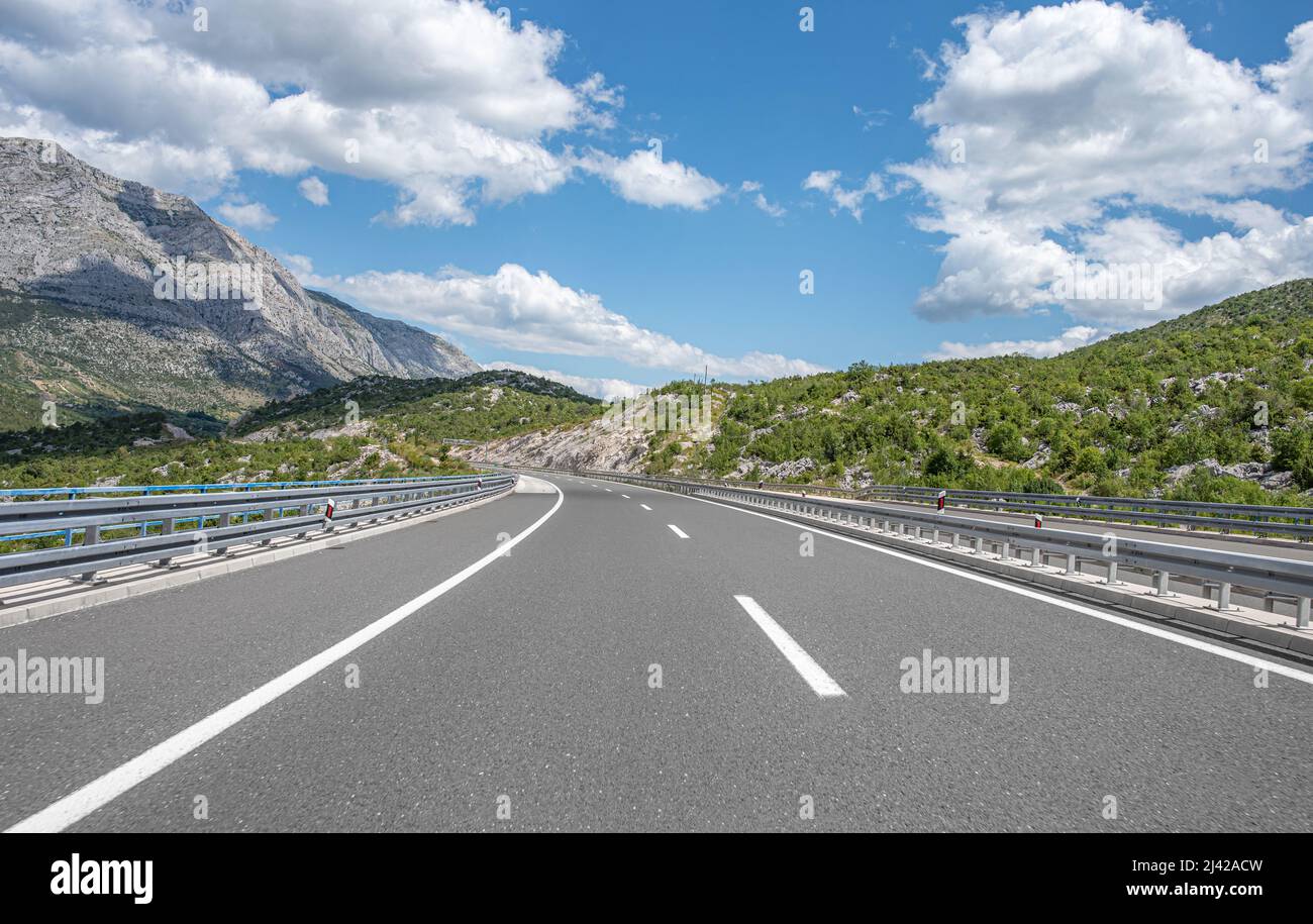 Scenic road. Road is surrounded by a magnificent natural landscape ...