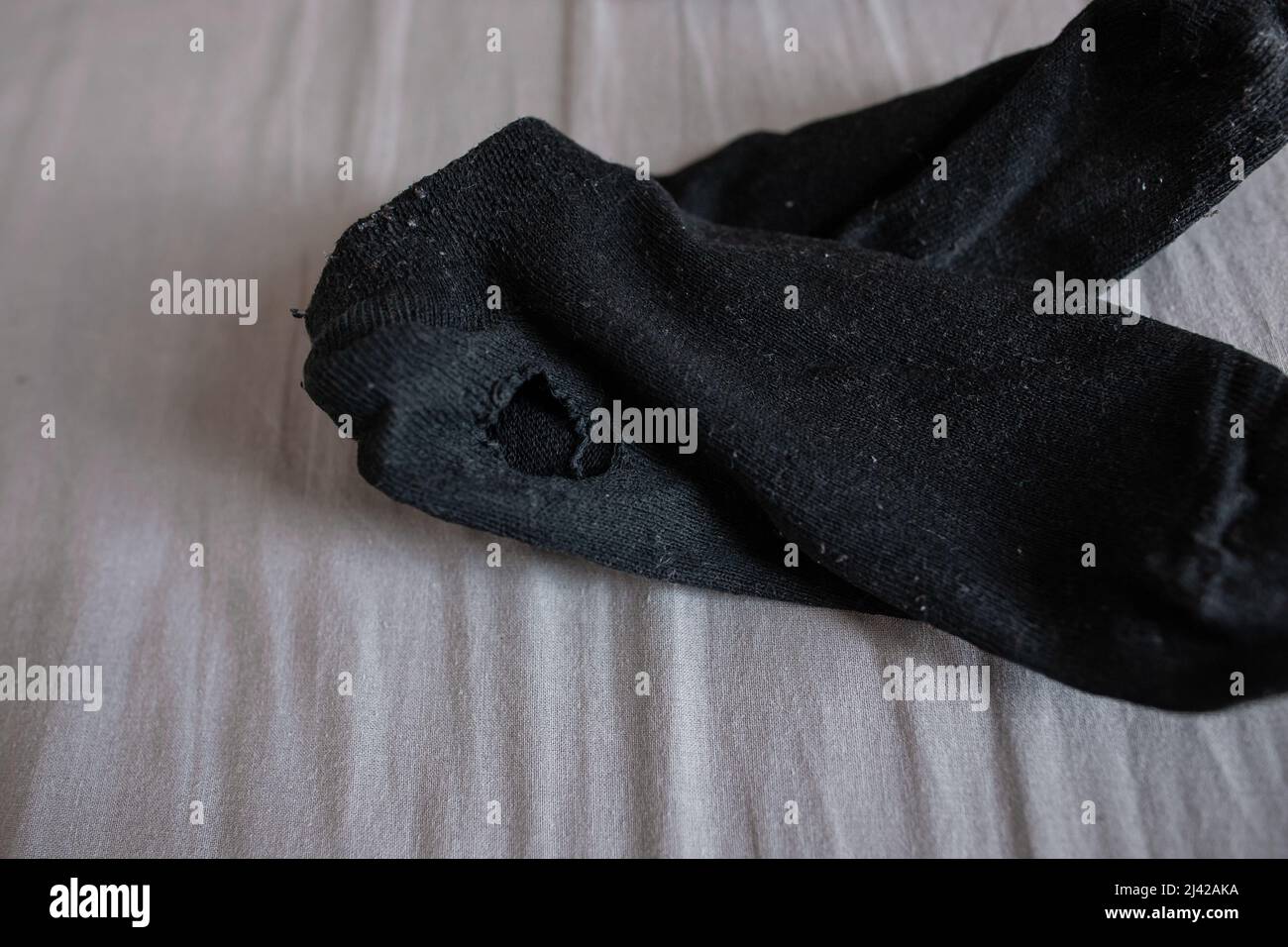 Socks with holes hi-res stock photography and images - Alamy