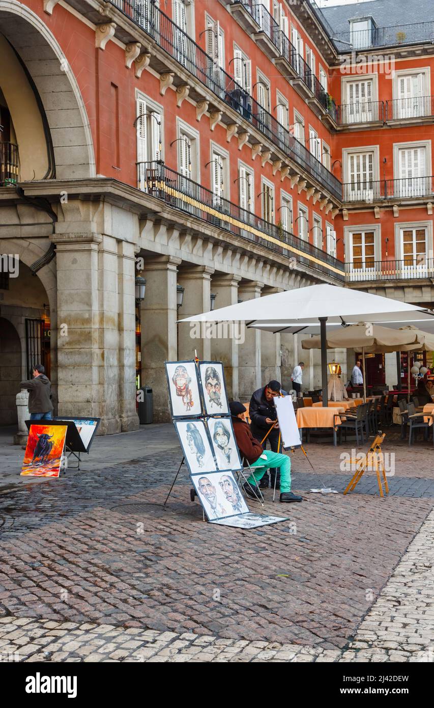 Local street artists display cartoons and pictures for tourist ...