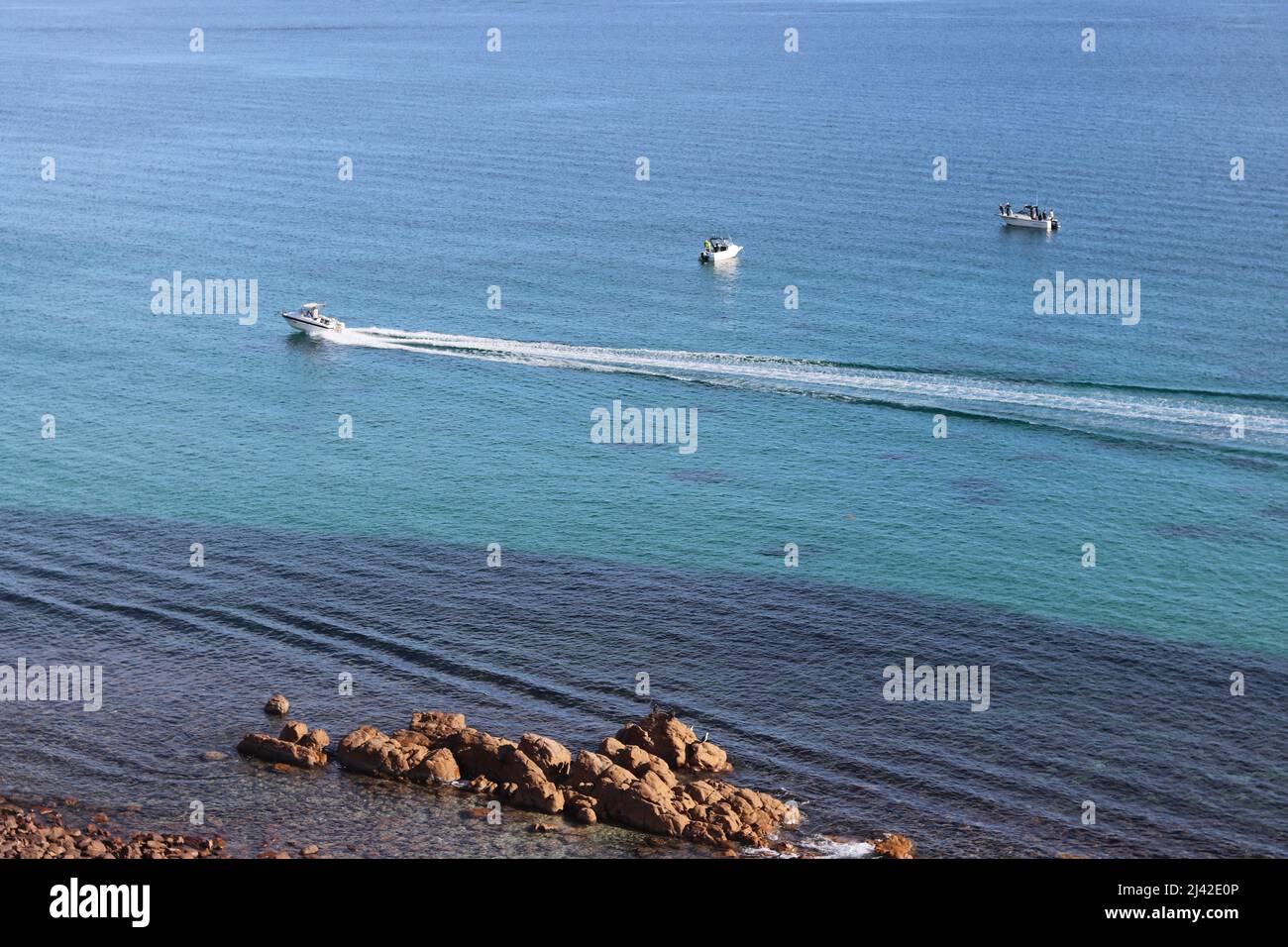 Ocean view - water, boats and rocks Stock Photo - Alamy