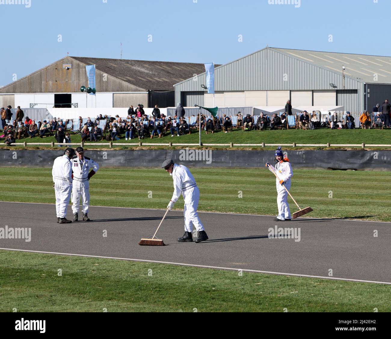 April 2022 - BARC race marshals sweep the track after the horses of the ...