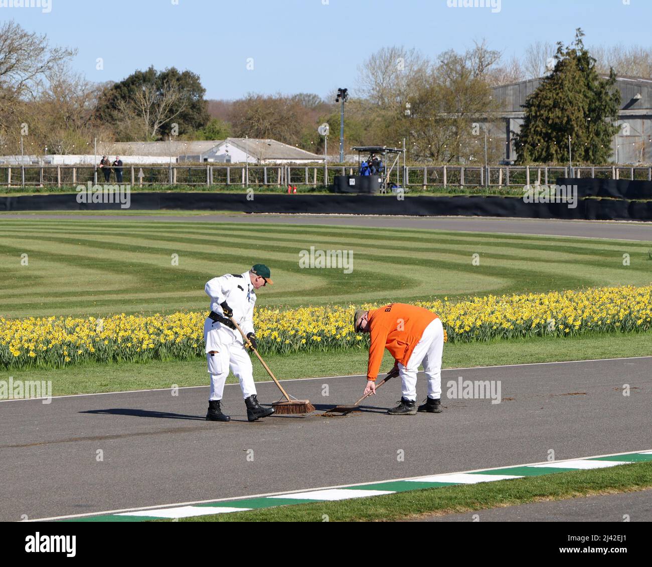 April 2022 - BARC race marshals sweep the track after the horses of the ...