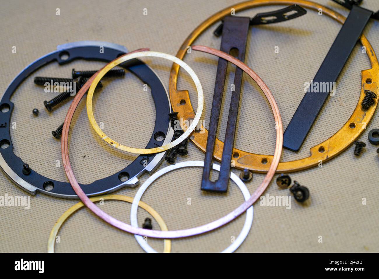 Clean and disassemble the lens for photography into its component parts ...