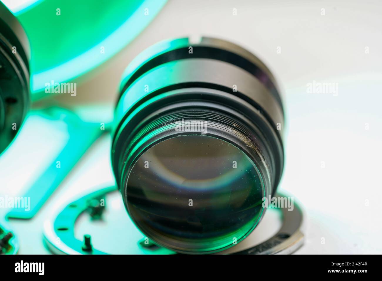 Clean and disassemble the lens for photography into its component parts ...