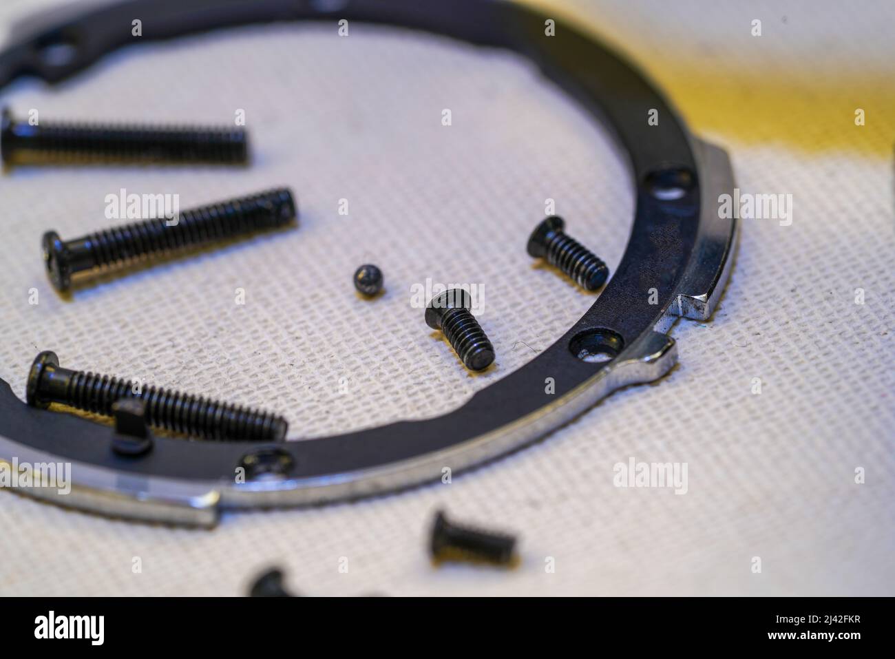 Clean and disassemble the lens for photography into its component parts ...