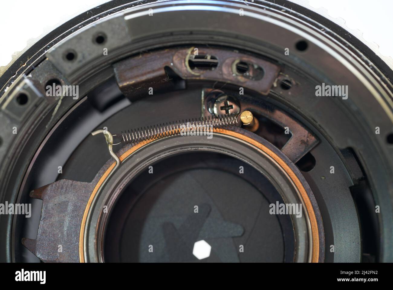Clean and disassemble the lens for photography into its component parts ...