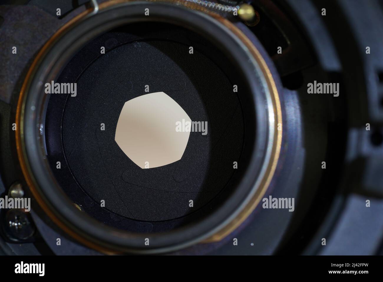Clean and disassemble the lens for photography into its component parts ...