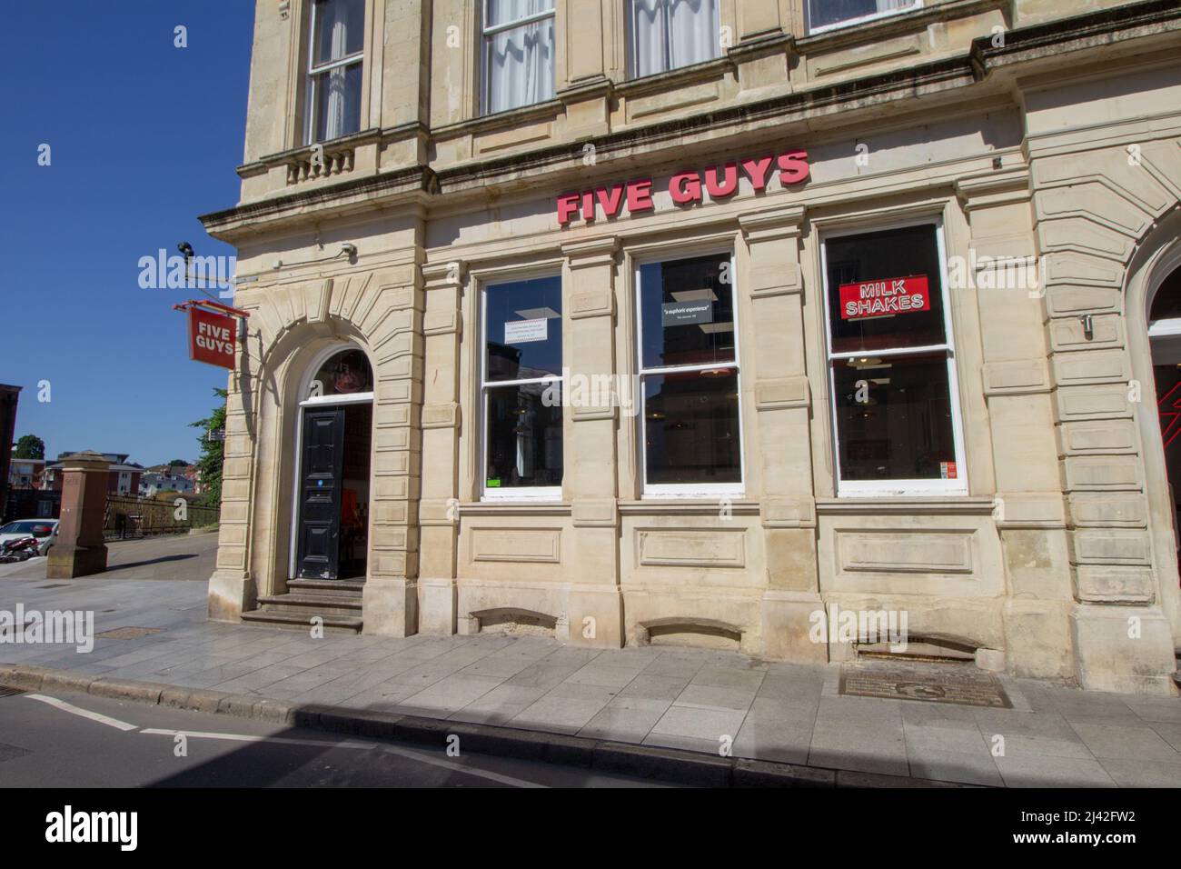 EXETER, UK - JULY 18, 2021 entrance to branch of Five Guys restaurant ...