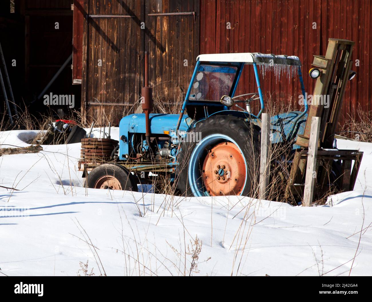 An old tractor on a farm Stock Photo - Alamy