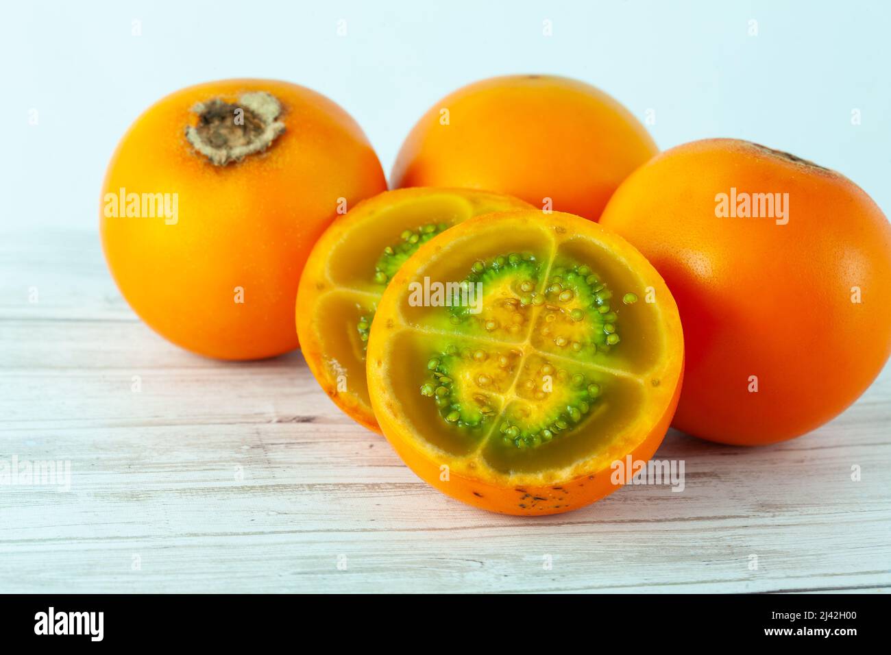 Exotic tropical fruit called Lulo (Solanum quitoense) on white ...