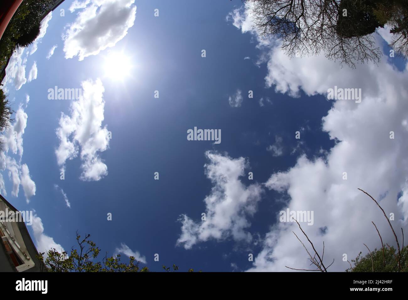 round sky with clouds and the sun Stock Photo - Alamy
