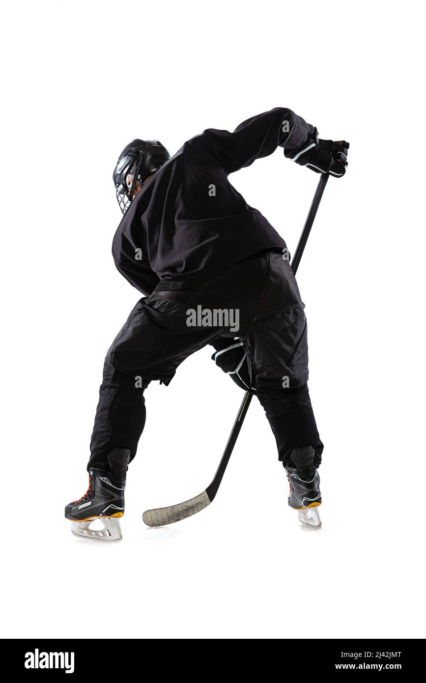 Back view full-length portrait of professional hockey player in motion ...