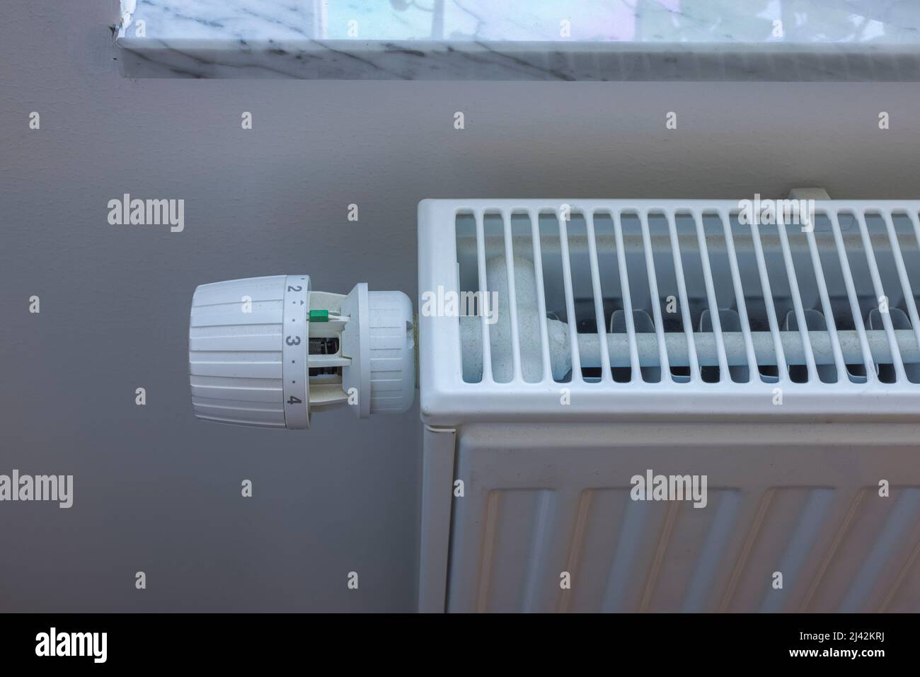 Beautiful view of thermostat knob on heating radiator in apartment ...