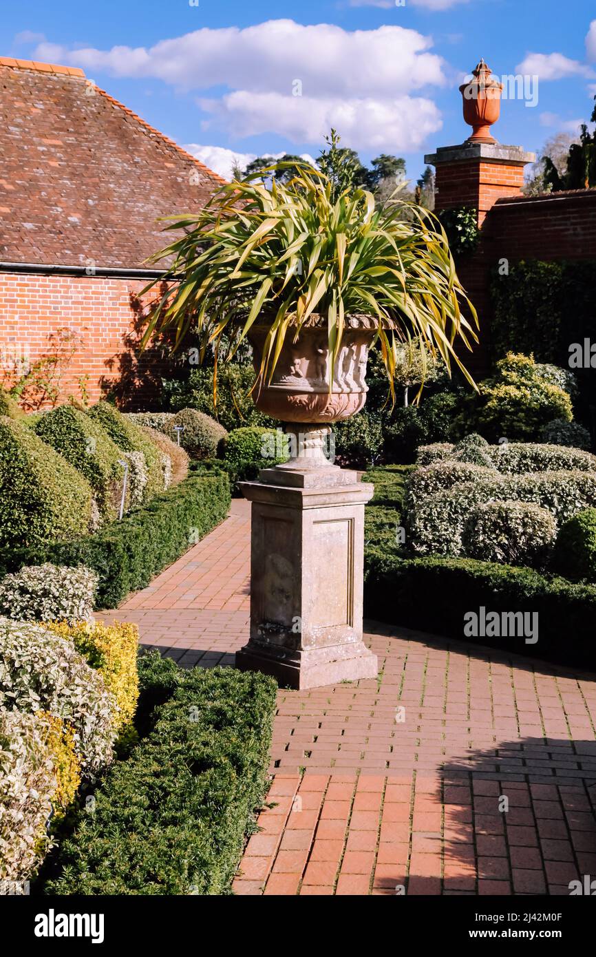 centrepiece pot plant on pillar in walled garden at RHS Garden Wisley ...
