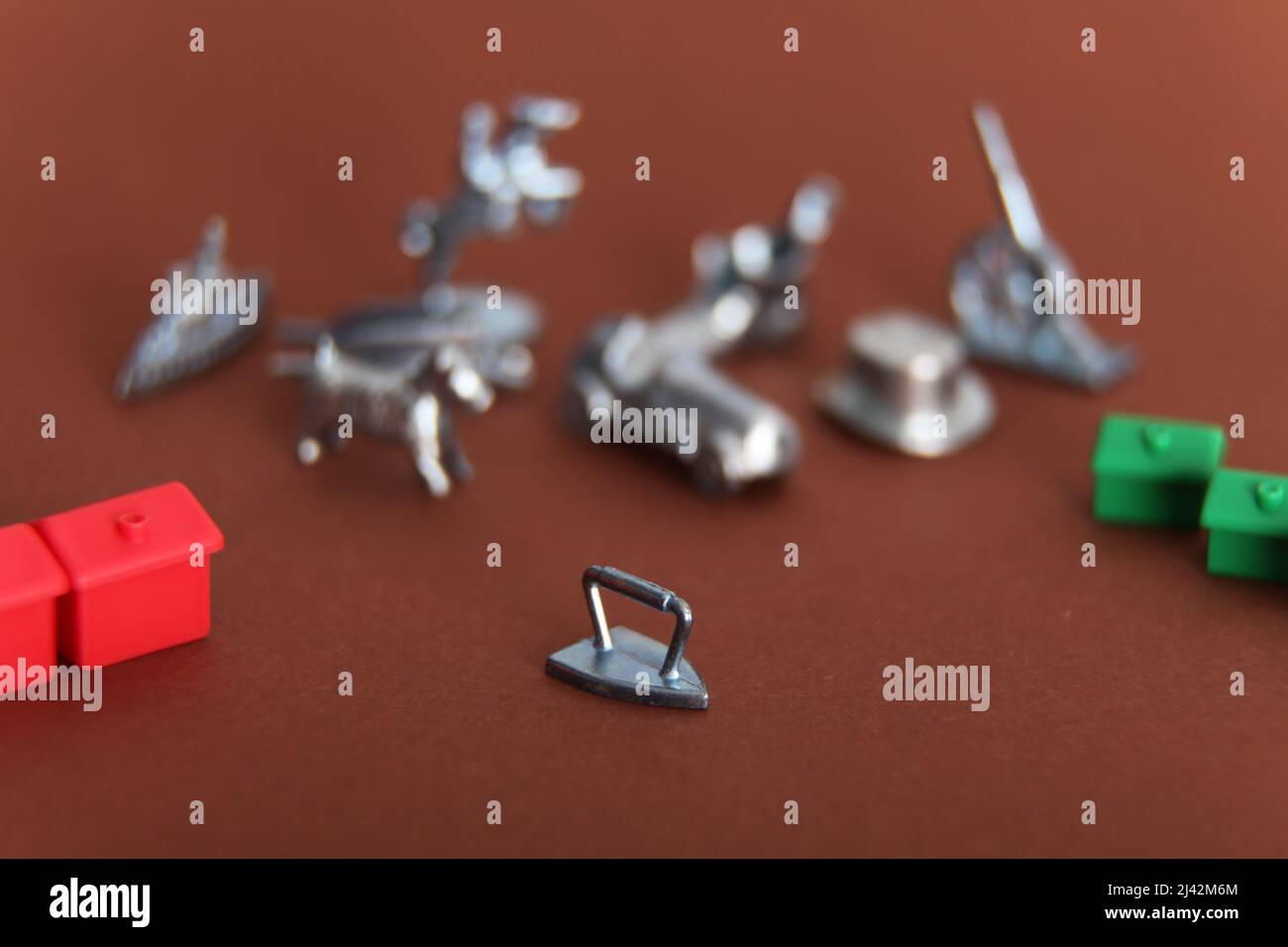 Monopoly games pieces with 1 iron icon piece in focus and other icons ...