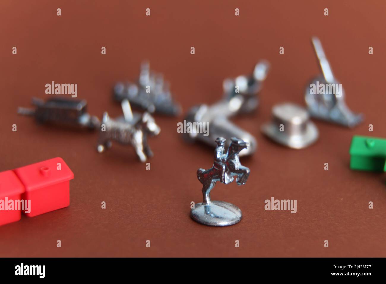 Monopoly games pieces with 1 horse rider icon piece in focus and other ...