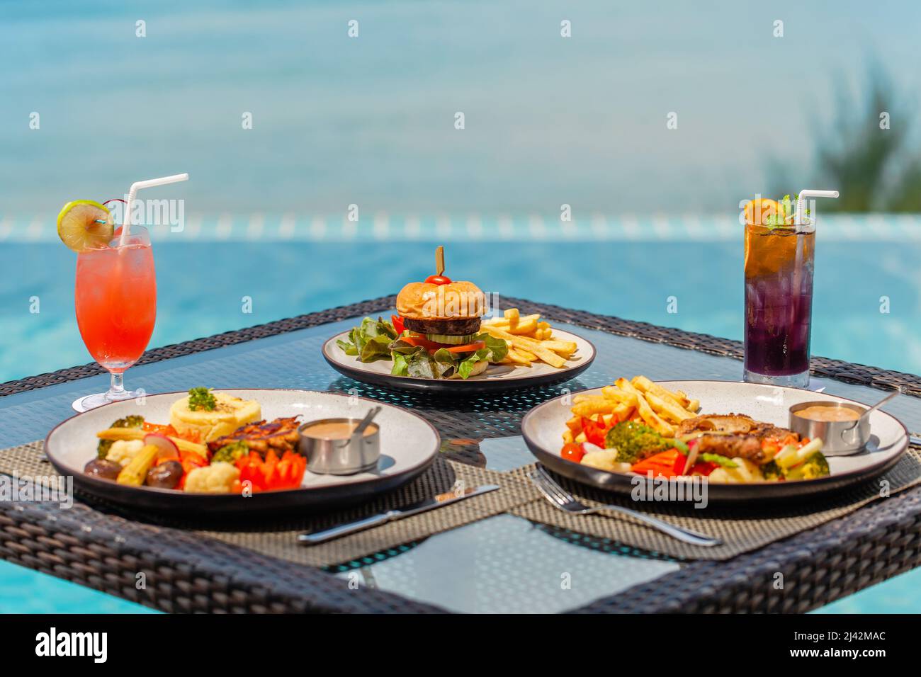 Luxurious breakfast or dinner food on table with beautiful tropical sea ...