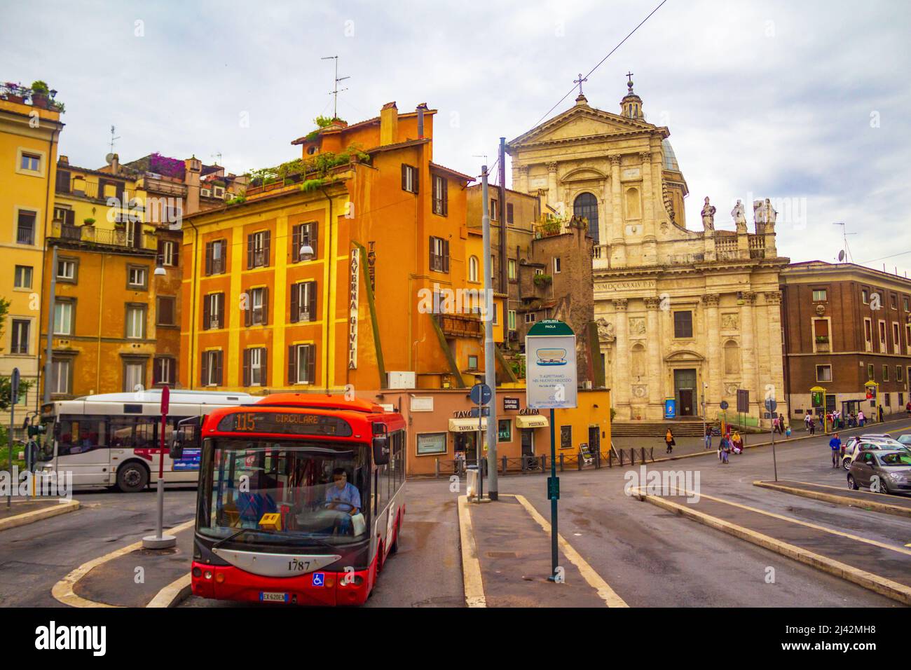 Busy street in the historical centre of Rome city on a rainy summer day ...
