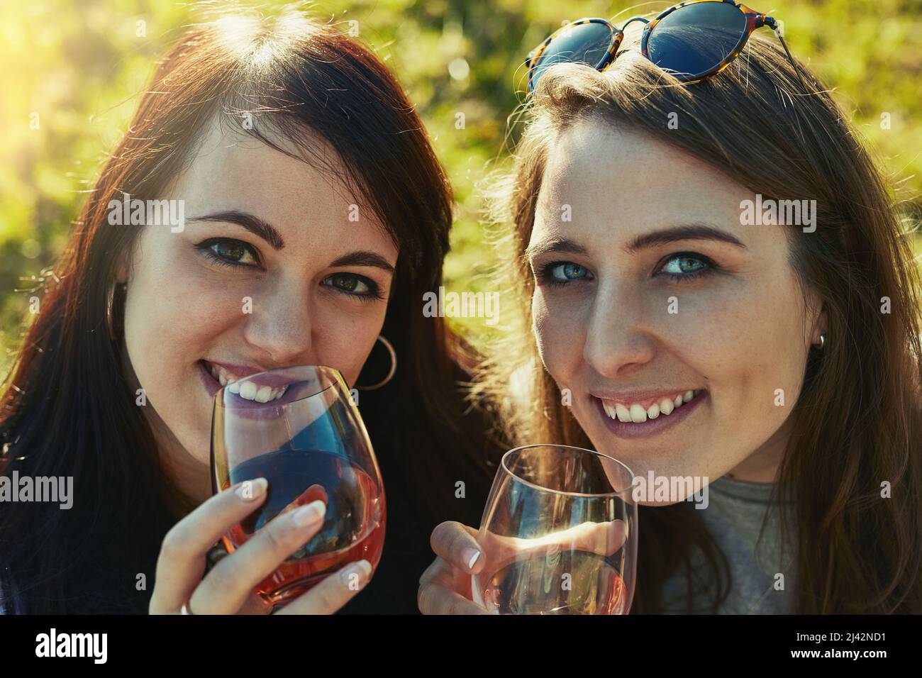 Heres to lifelong friendships. Portrait of two young friends enjoying ...