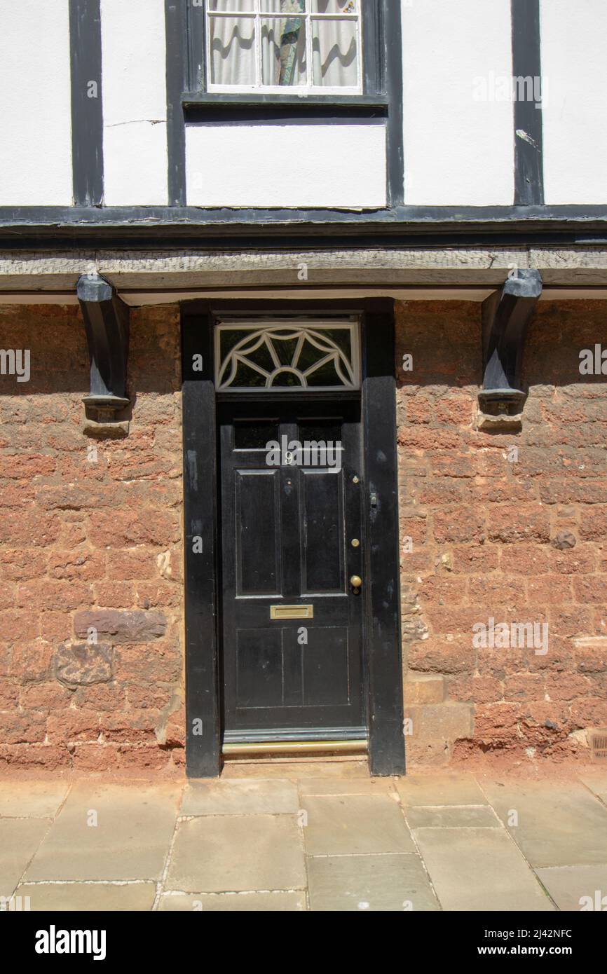 EXETER, UK - JULY 18, 2021 traditional entrance doors to historic and ...