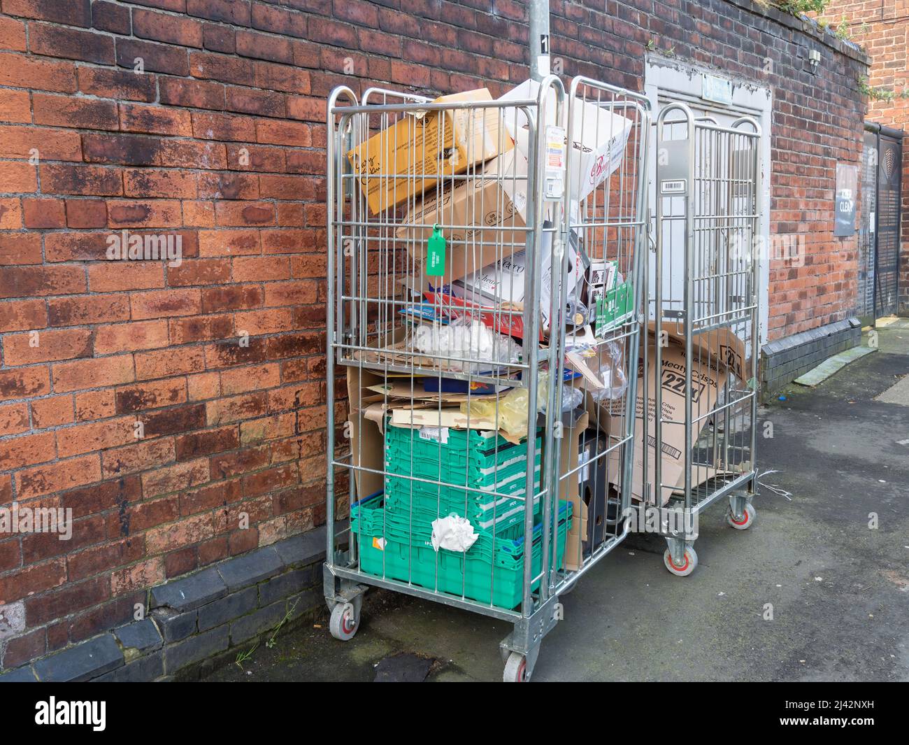 31.03.2022 St Helens, Merseyside, UK. Container cages on wheels full of ...