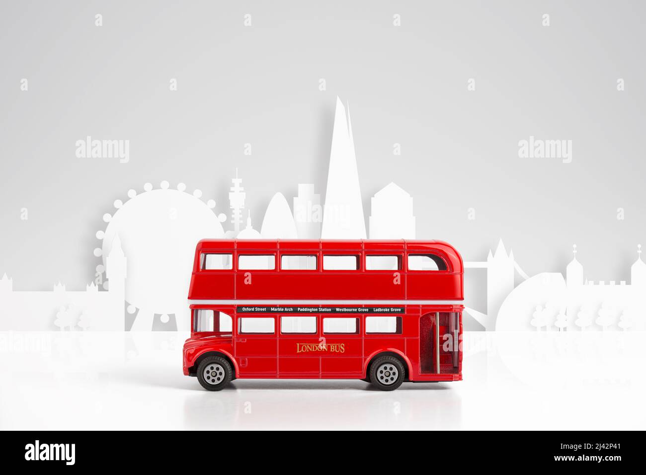 Red Model Bus & London skyline concept Stock Photo - Alamy