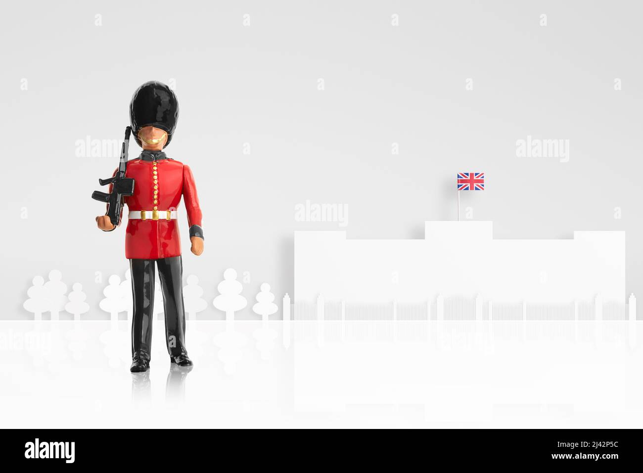 Queens guard model & buckingham palace London concept Stock Photo - Alamy