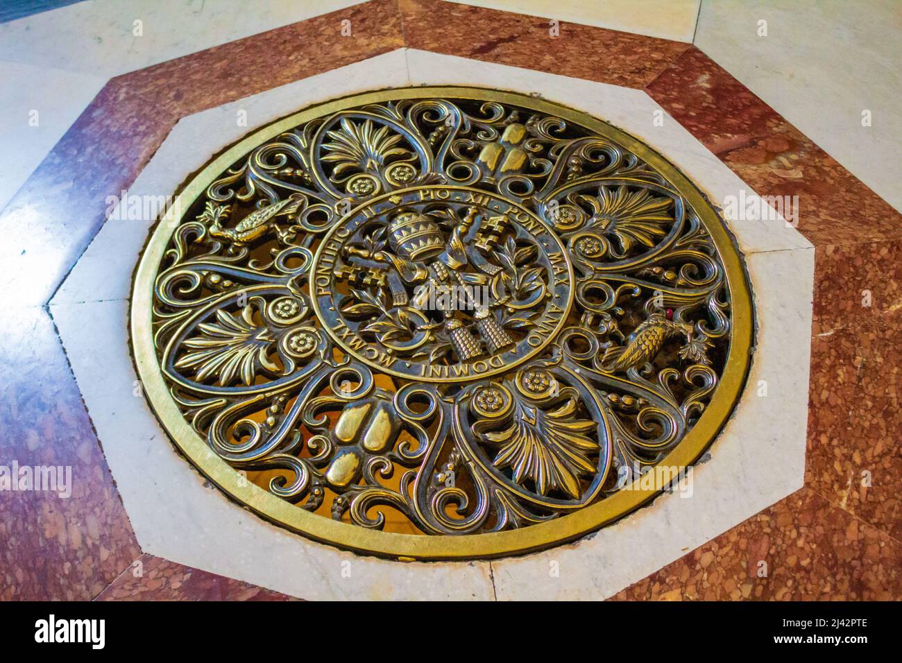 Air vents for the crypt ,a decorative manhole on the marble floor ...