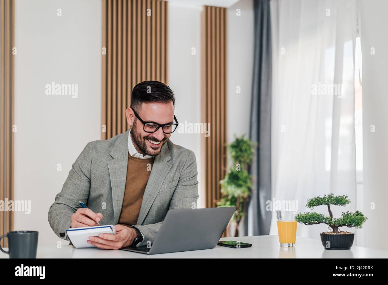 Cheerful adult man, conducting an online job interview with possible ...