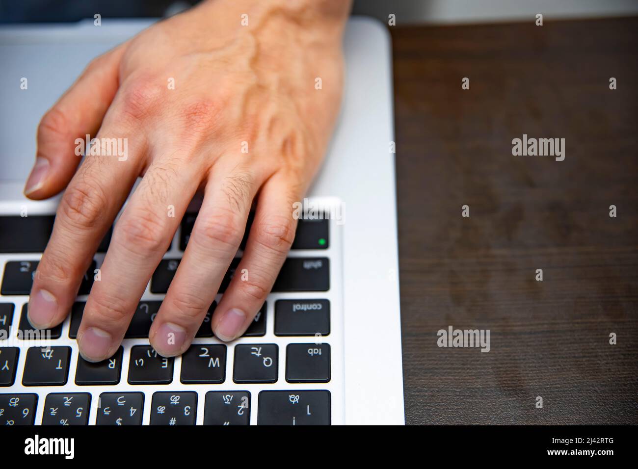 Close up of a human hand on a computer keyboard hi-res stock ...