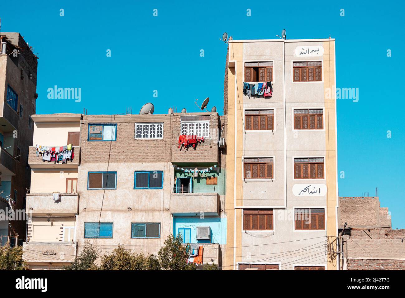 11 January 2022, Qena, Egypt: Urban slums and the facade of the ...