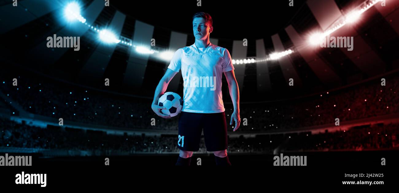 One professional soccer, football player in football kit standing with ...