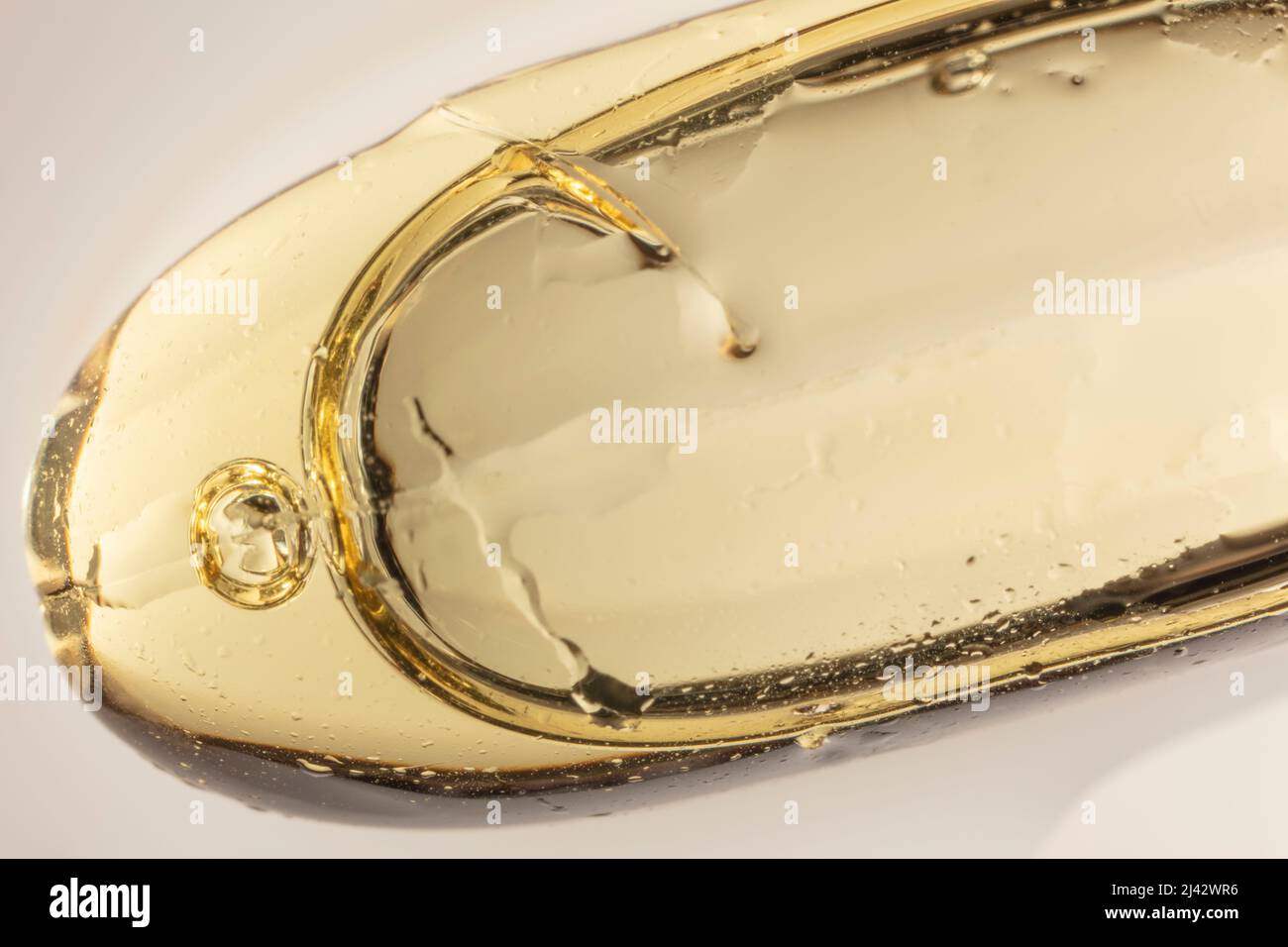 Macro still-life showing abstract patterns in Omega-3 oil capsule ...