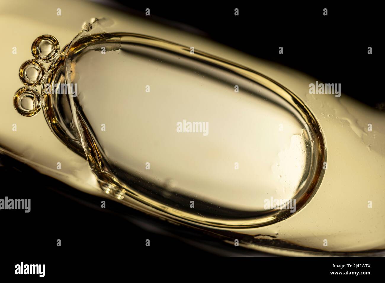 Macro still-life showing abstract patterns in Omega-3 oil capsule ...