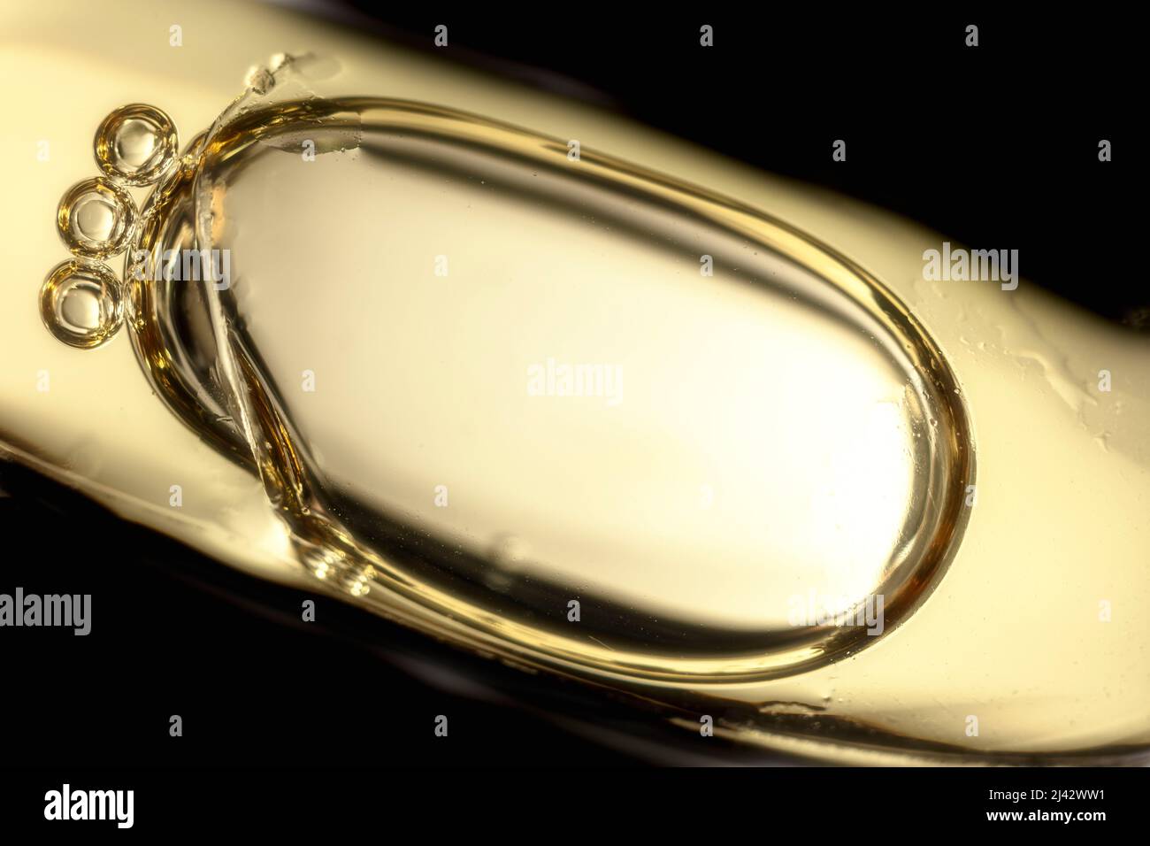 Macro still-life showing abstract patterns in Omega-3 oil capsule ...