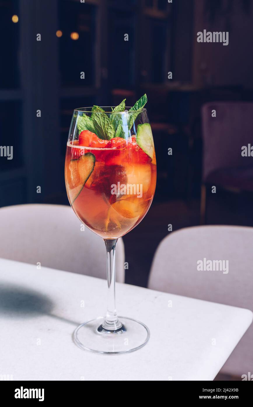 Glass of cocktail standing on a table, summer days Stock Photo - Alamy