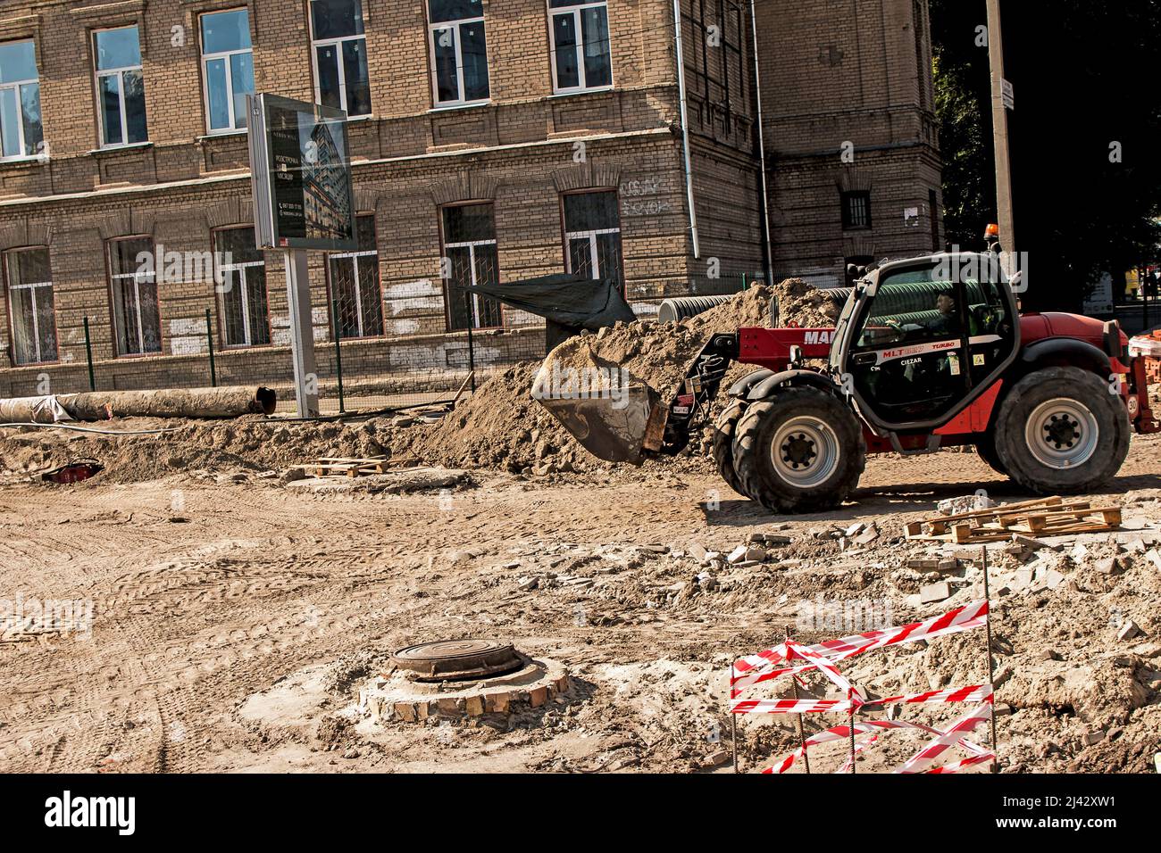 Dnepropetrovsk, Ukraine - 10.05.2021: The grader takes out the sand ...