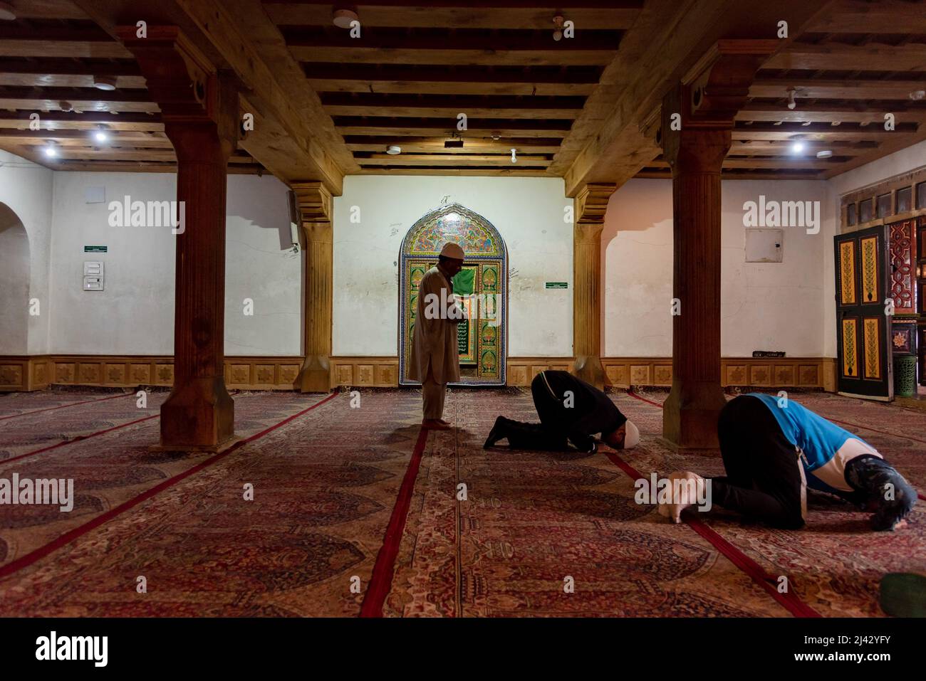 Muslim devotees offer prayers inside a shrine during Islamic holy month ...