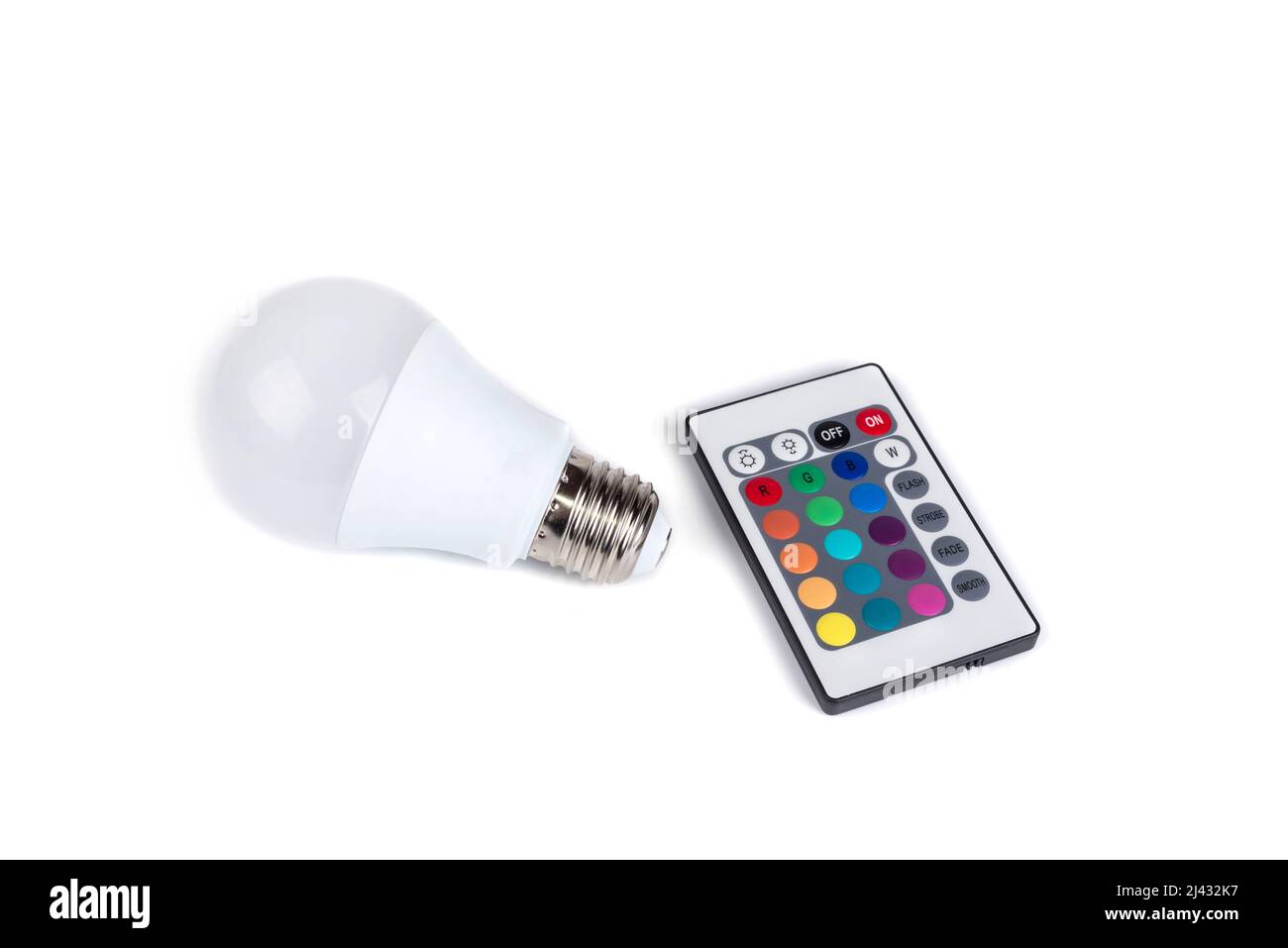 Multi color led bulb with a remote control on a white background Stock ...