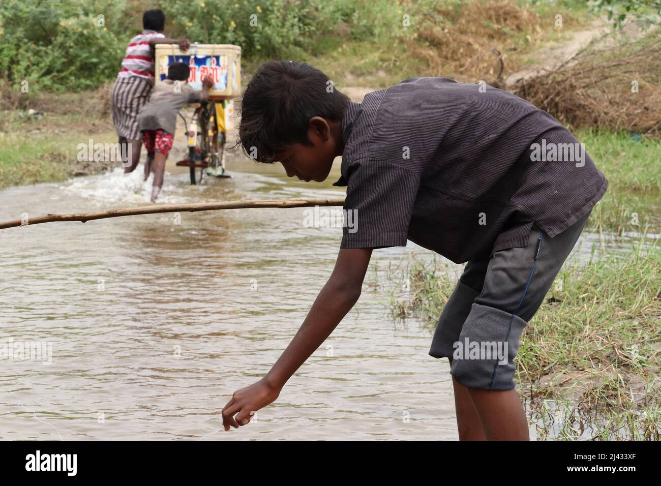 A Village Boy fishing in the River in his Holiday Stock Photo - Alamy