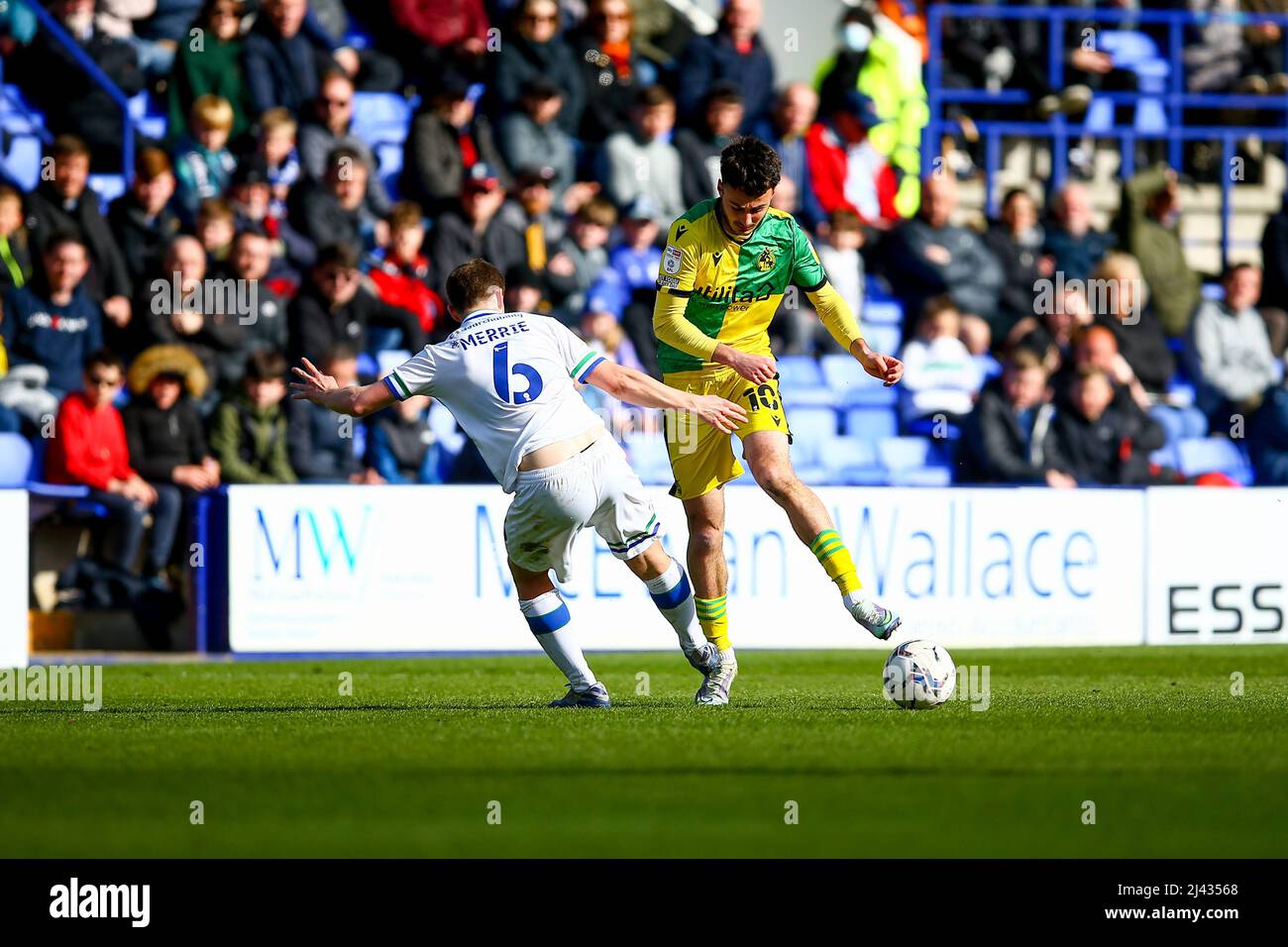 Aaron Collins (10) of Bristol Rovers is fouled by Chris Merrie (6) of ...