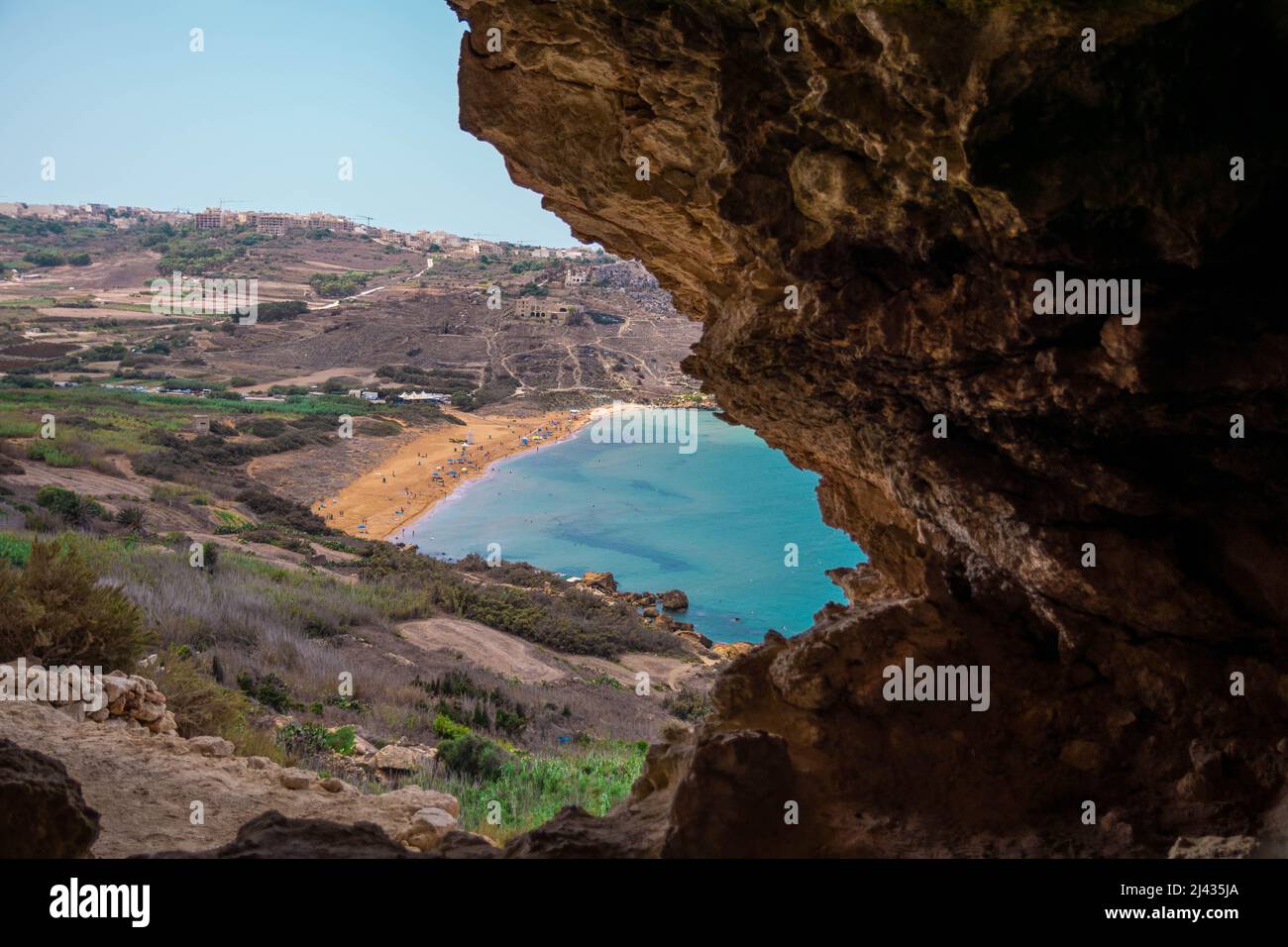 View at beautiful Ramla Beach from Tal Mixta Cave, Malta Stock Photo ...