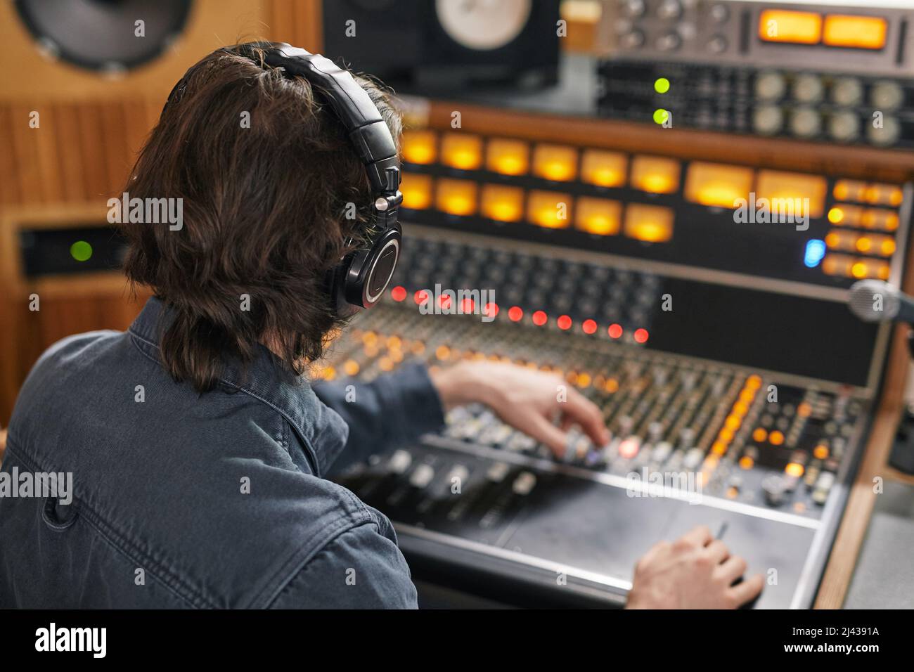 High angle at music producer operating audio workstation in ...