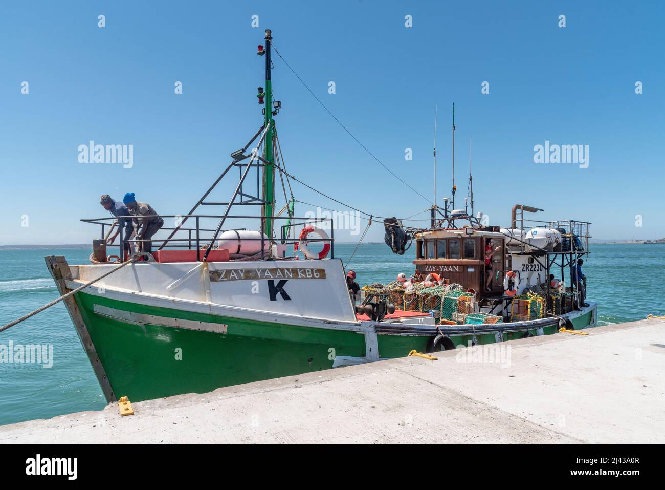Two workers tying hi-res stock photography and images - Alamy