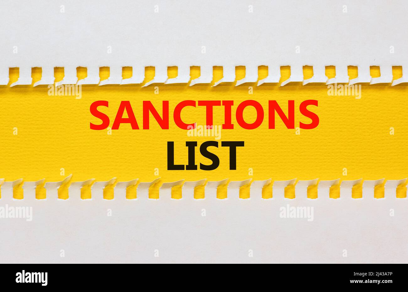 Sanctions list symbol. Yellow and white paper with concept words ...