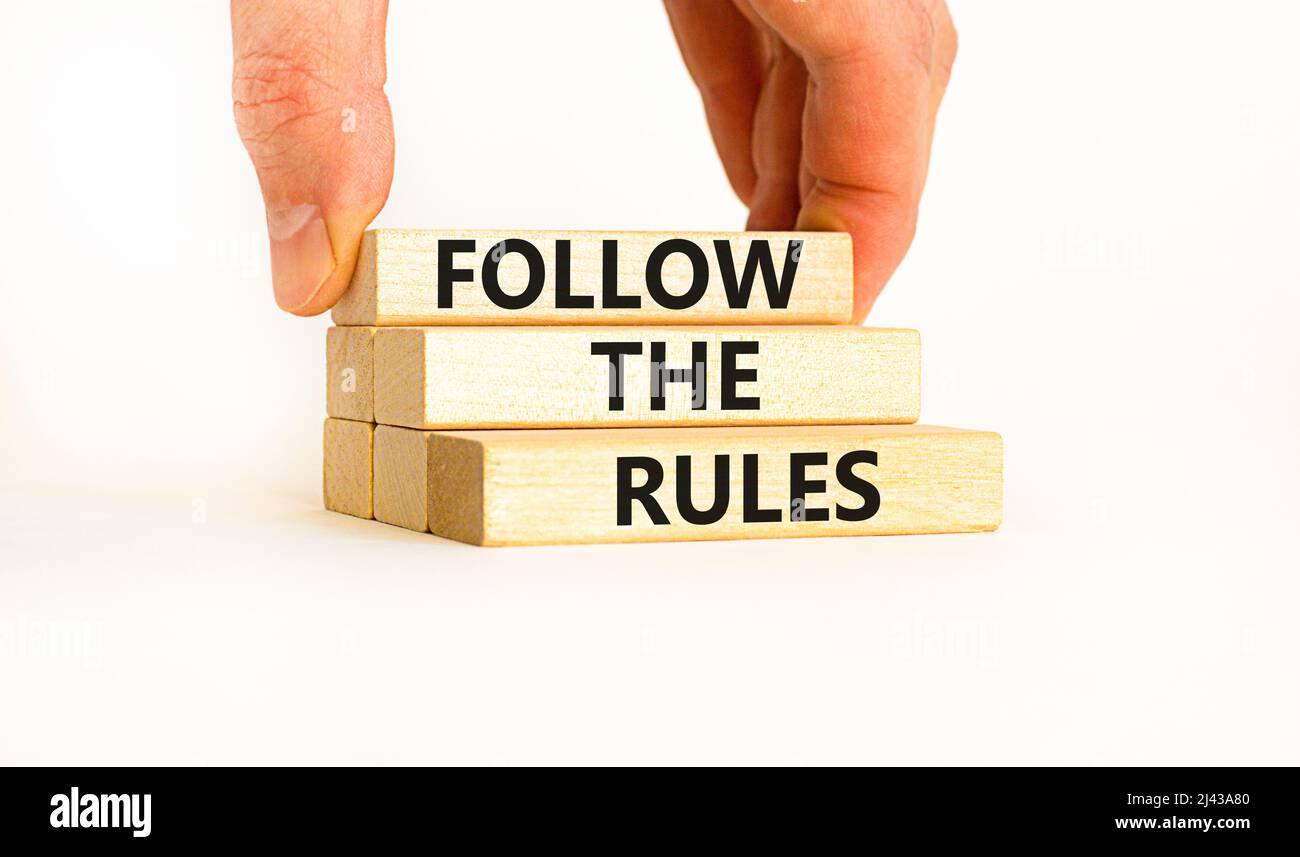 Follow the rules symbol. Concept words Follow the rules on wooden ...